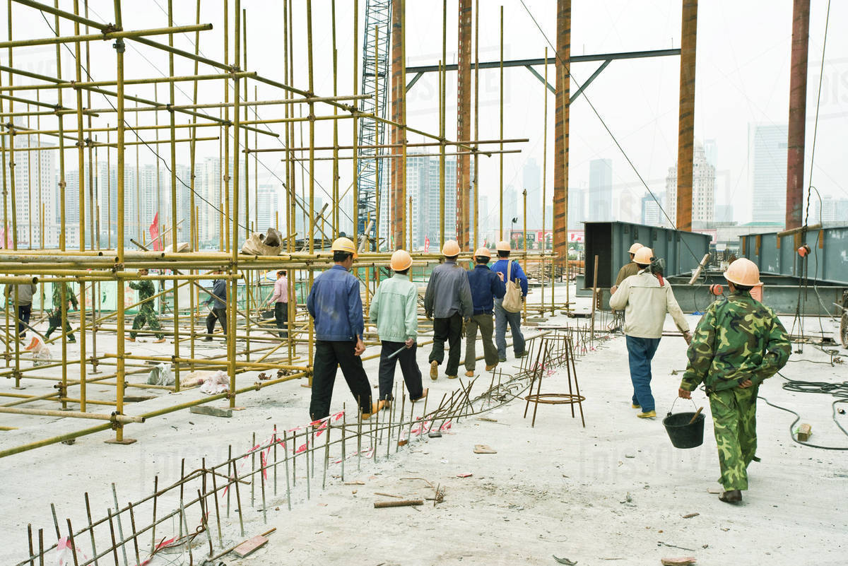 Construction workers leaving construction site - Royalty-free Stock ...
