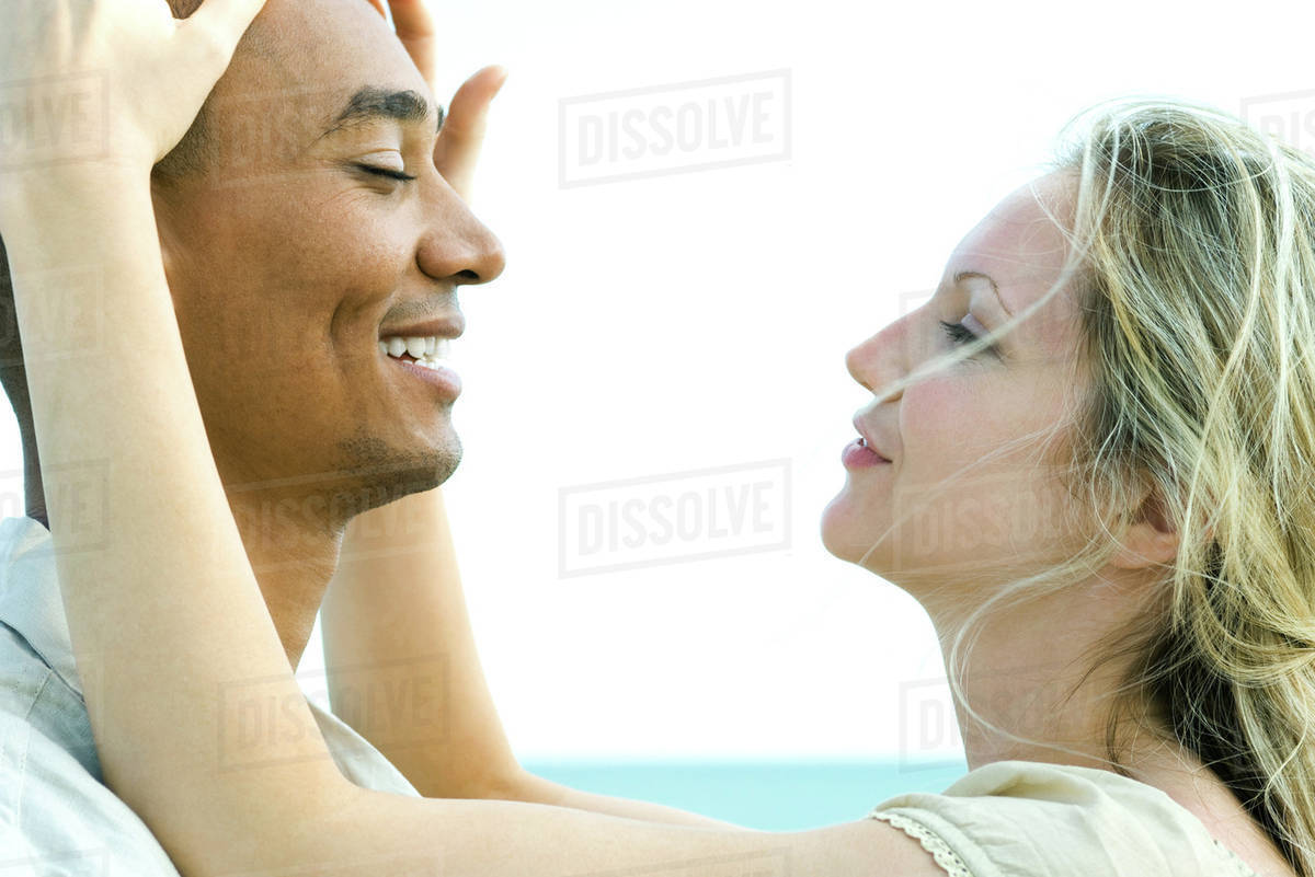 Couple face to face with eyes closed, woman touching man's head - Stock ...