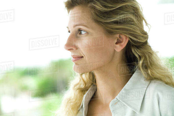 Woman, head and shoulders, side view - Royalty-free Stock Photo | Dissolve