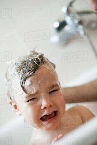 Toddler boy crying in the bath - Royalty-free Stock Photo | Dissolve