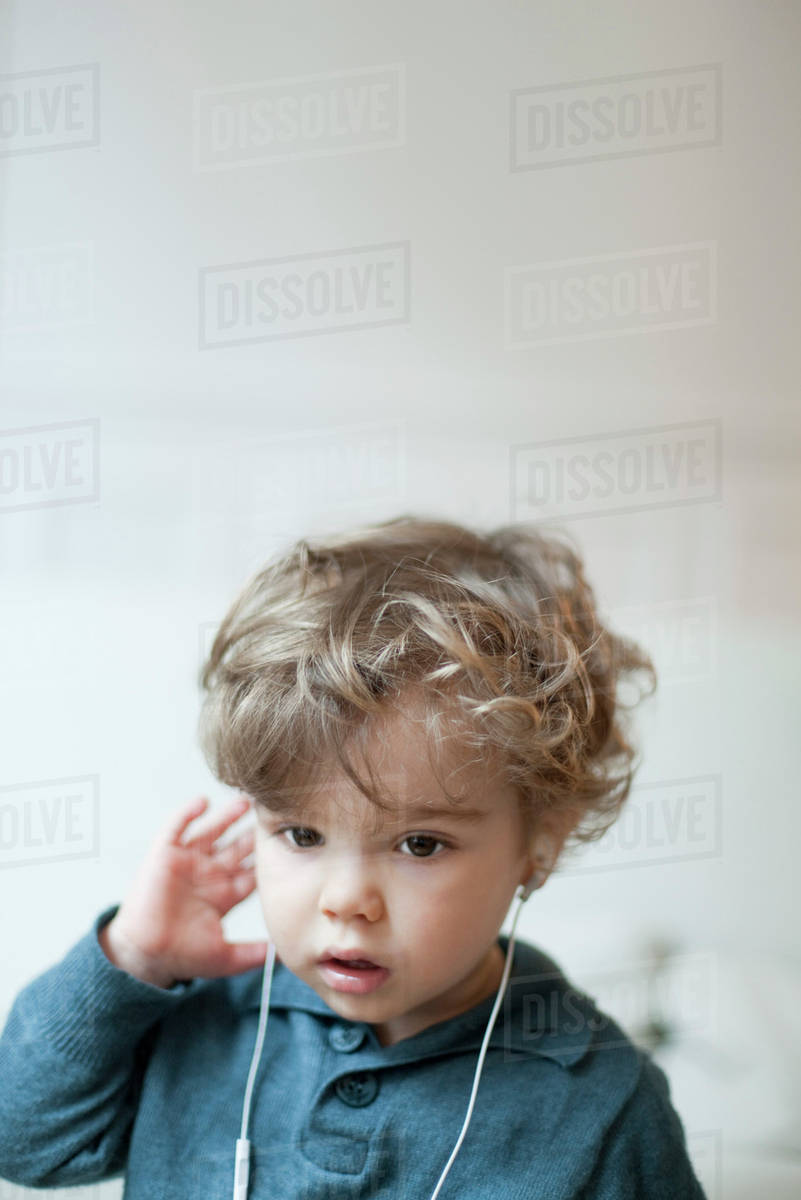 Toddler boy wearing earphones, portrait - Royalty-free Stock Photo ...