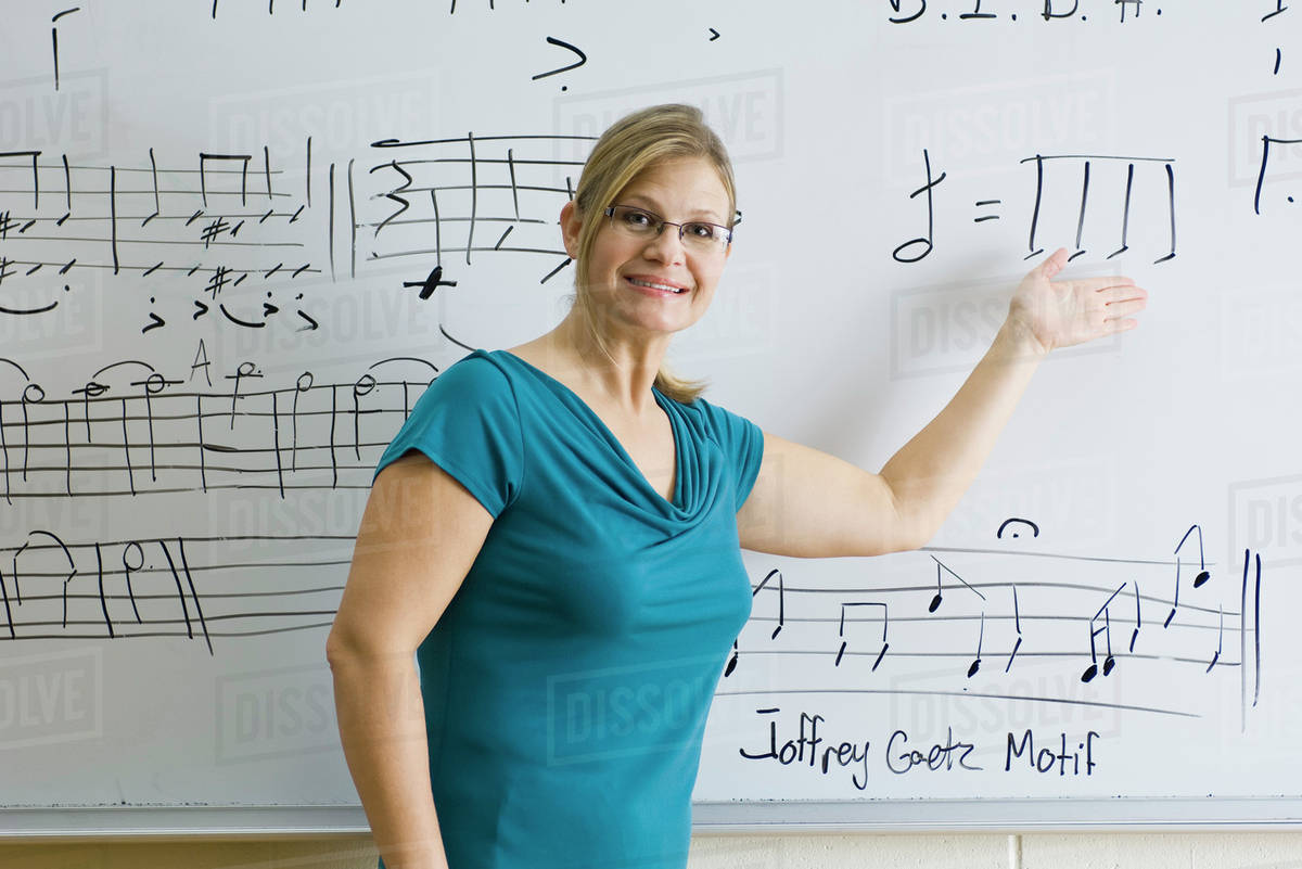 Woman teaching music theory class - Royalty-free Stock Photo | Dissolve