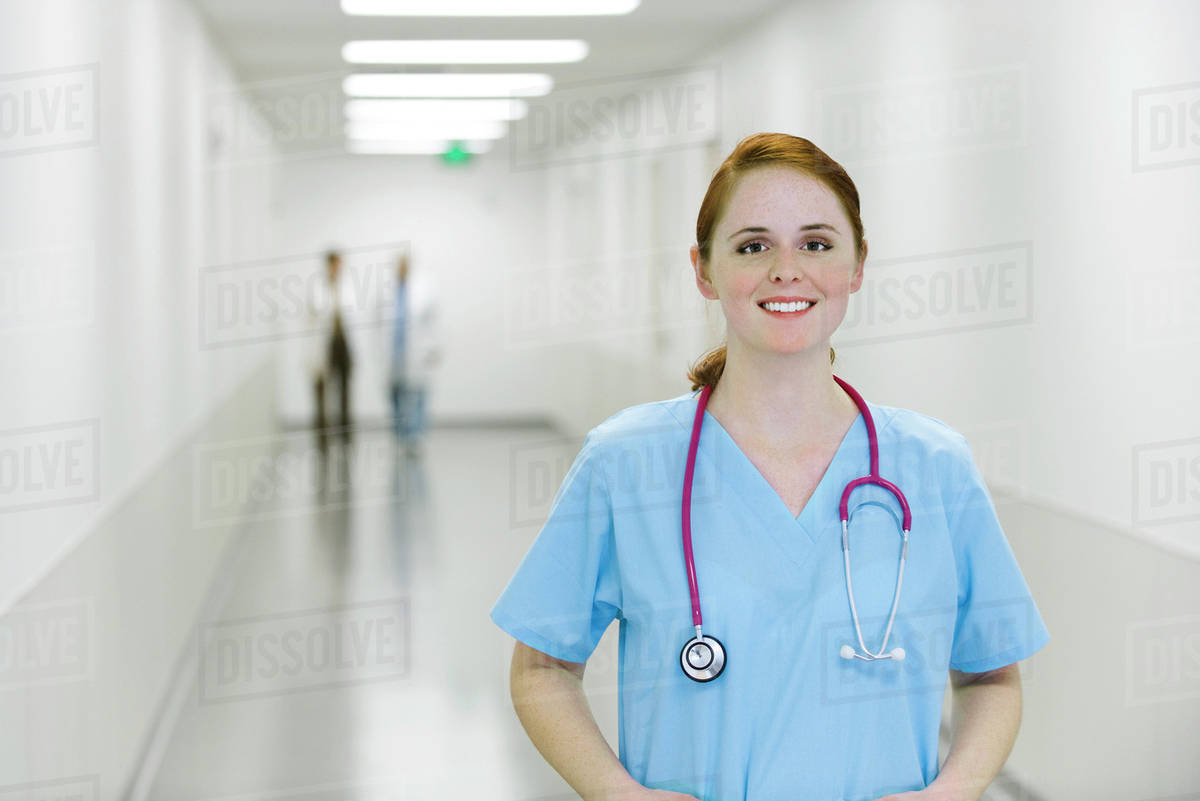 Nurse smiling, portrait - Stock Photo - Dissolve