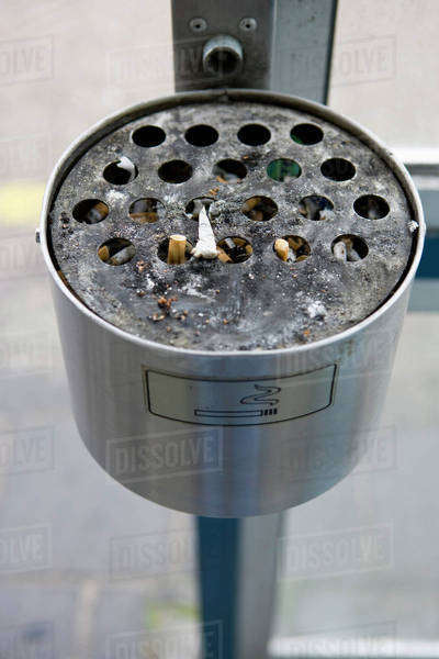Ashtray in outdoor smoking area - Royalty-free Stock Photo | Dissolve