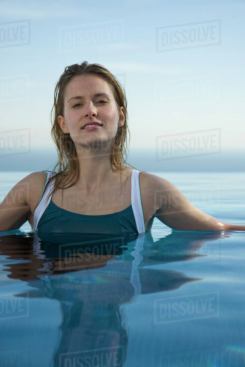 Woman relaxing in water, portrait - Stock Photo - Dissolve