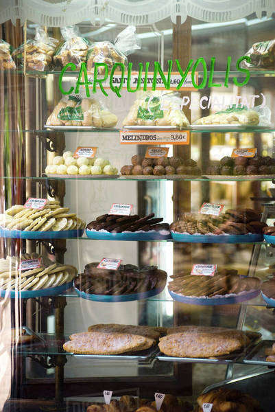 Bakery shop window display of assorted sweets - Stock Photo - Dissolve