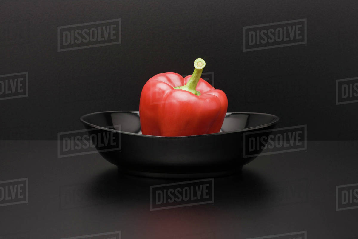 Fresh red bell pepper in bowl - Stock Photo - Dissolve