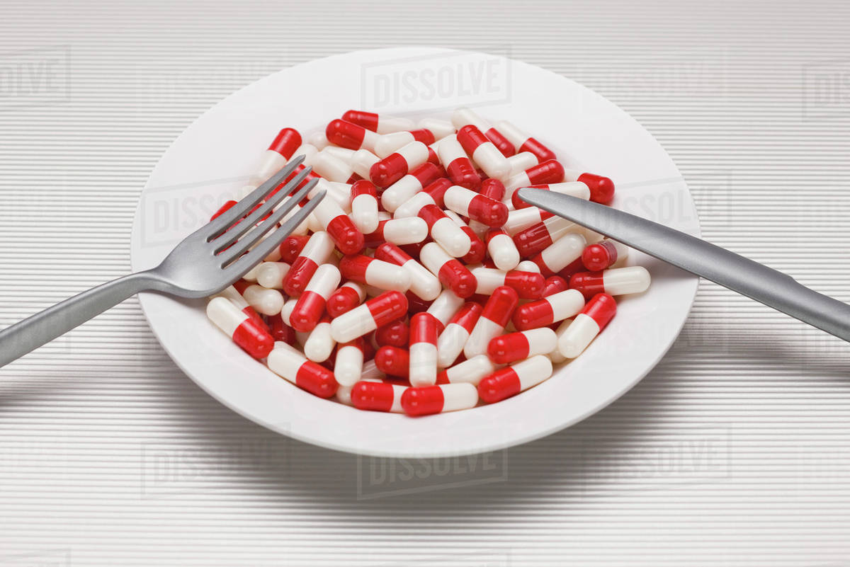 Food concept, plate full of pills - Royalty-free Stock Photo | Dissolve