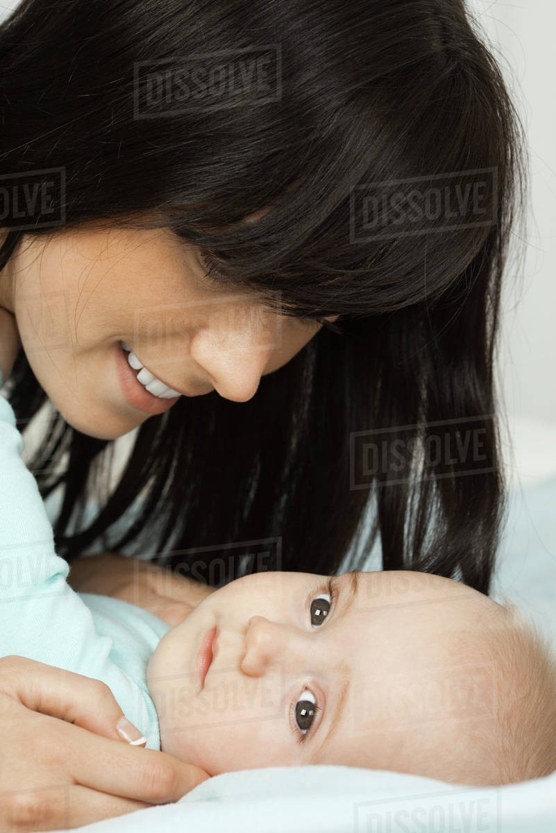 Mother smiling at baby - Royalty-free Stock Photo | Dissolve