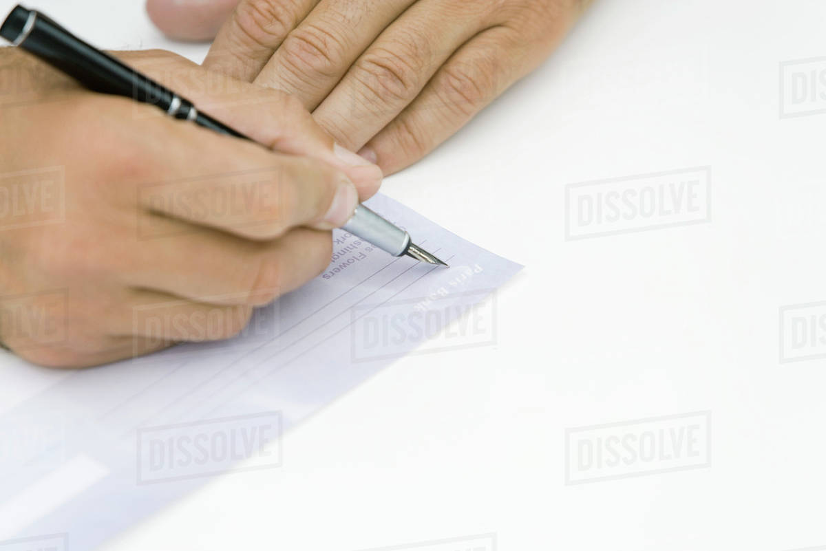 Hand signing document, close-up - Royalty-free Stock Photo | Dissolve