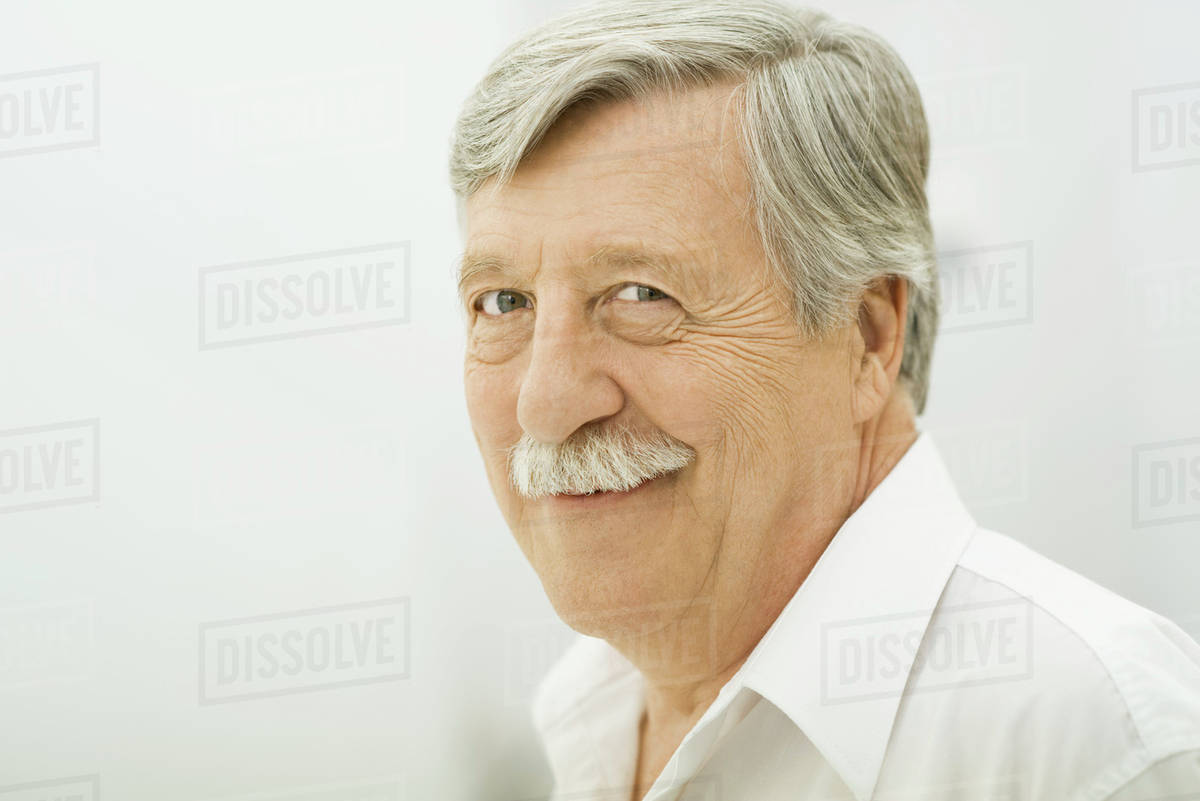 Senior man smiling at camera, portrait - Royalty-free Stock Photo ...