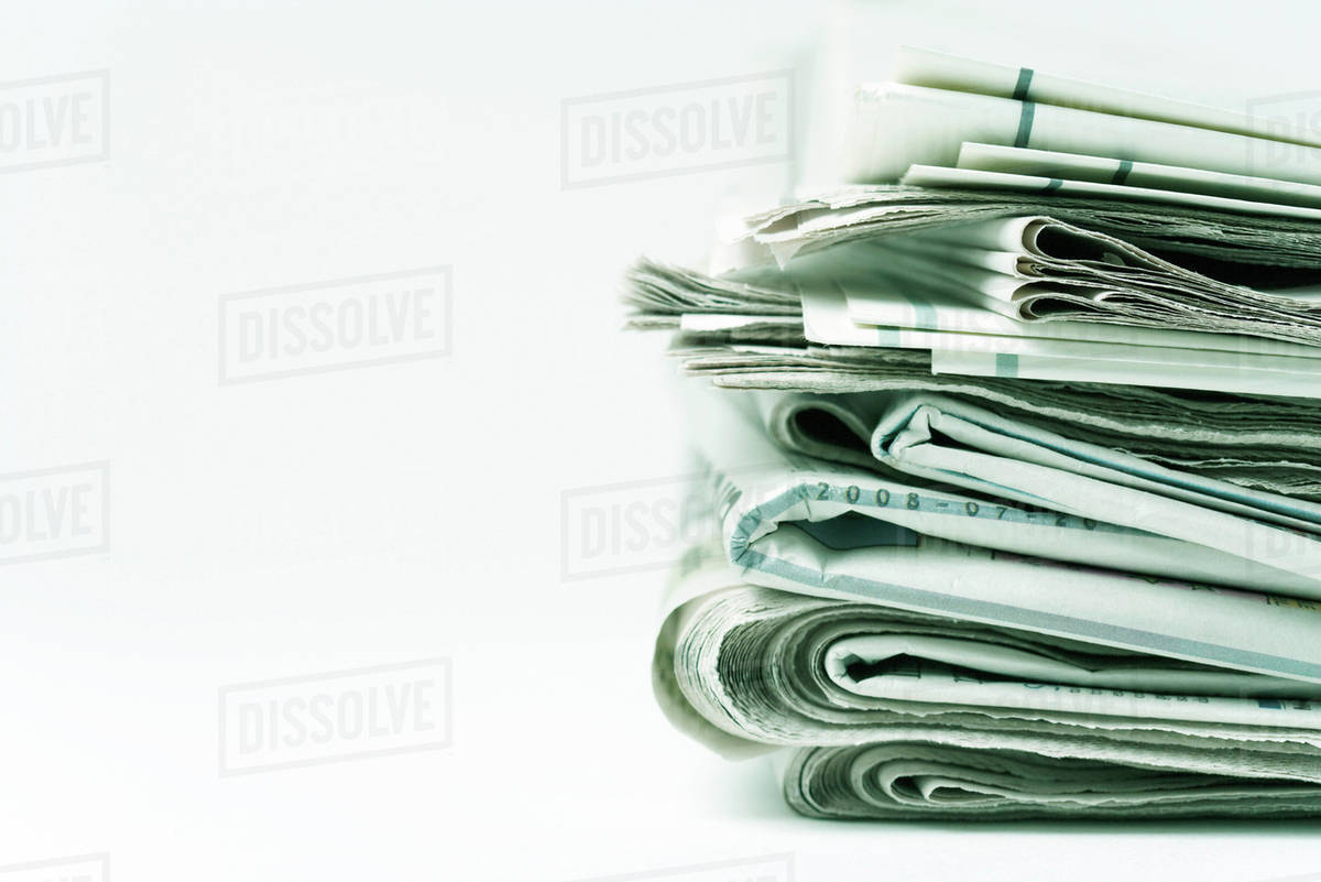 Stack of newspapers, close-up - Royalty-free Stock Photo | Dissolve