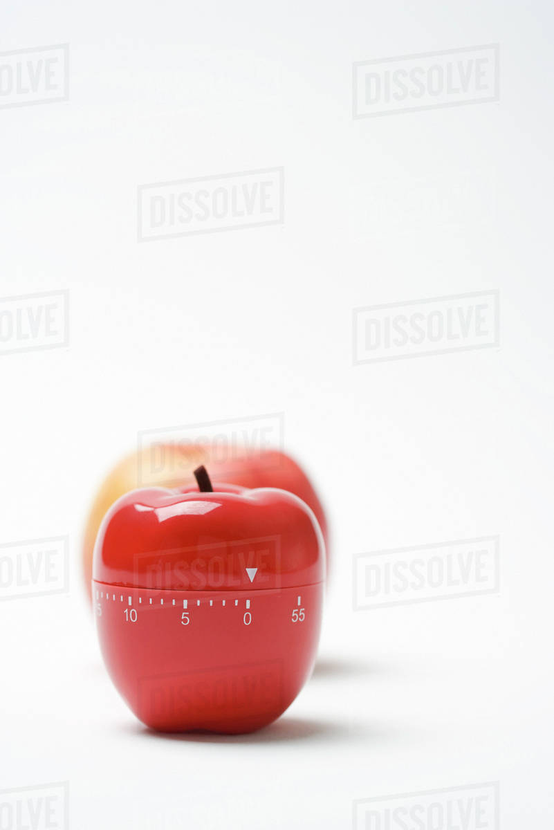 Apple shaped kitchen timer, real apple in background - Stock Photo ...