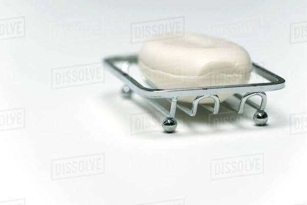 Soap in soap dish, close-up - Stock Photo - Dissolve