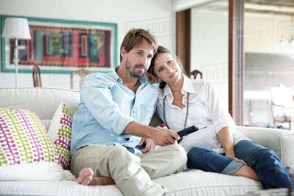 Couple watching TV together - Royalty-free Stock Photo | Dissolve