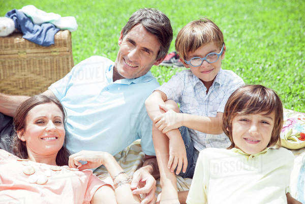 Family relaxing together outdoors - Royalty-free Stock Photo | Dissolve