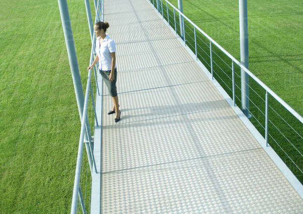 Woman standing on walkway, full length, high angle view - Stock Photo ...