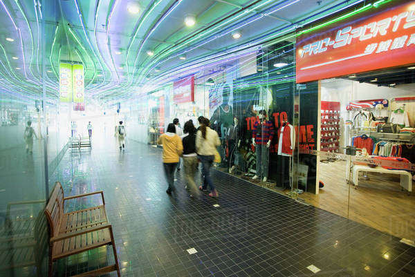 Shoppers walking through mall - Royalty-free Stock Photo | Dissolve