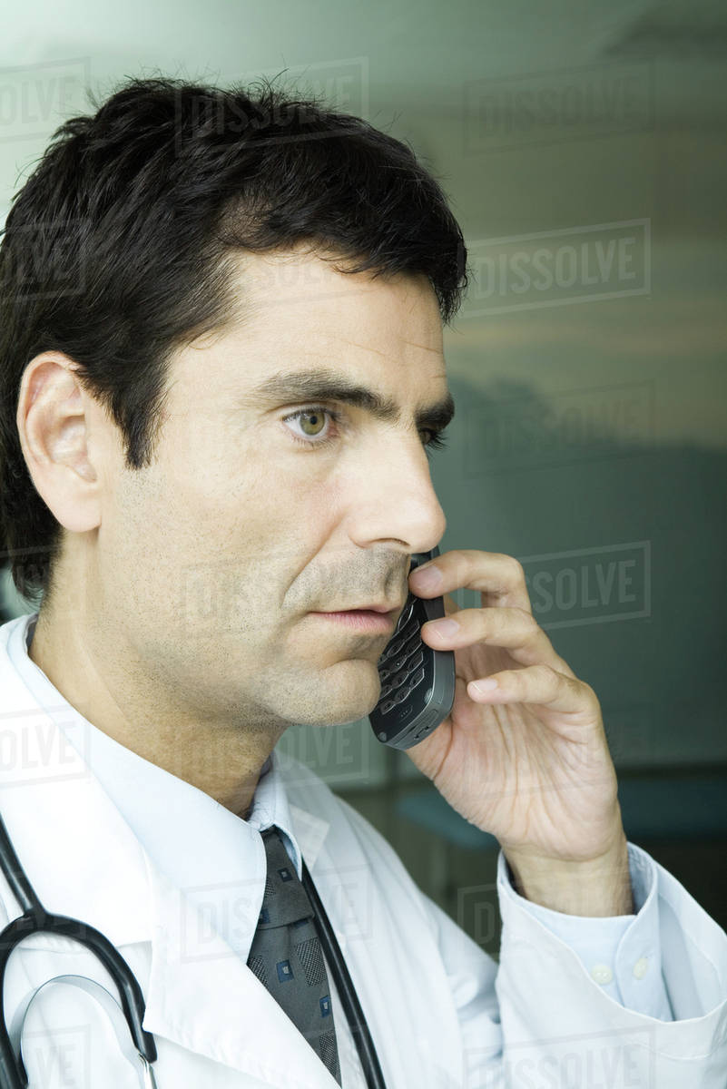 Doctor making phone call - Royalty-free Stock Photo | Dissolve