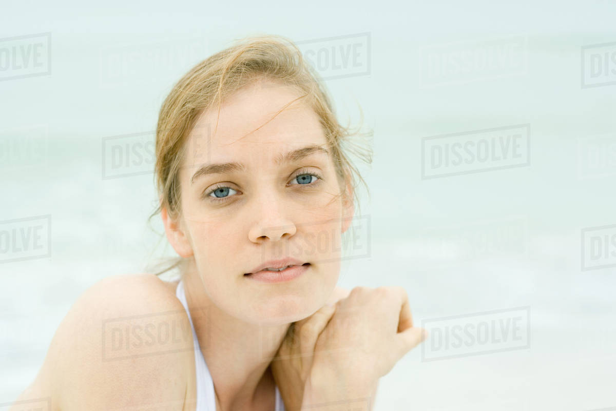 Young woman, head and shoulders, portrait, sea in background - Stock ...