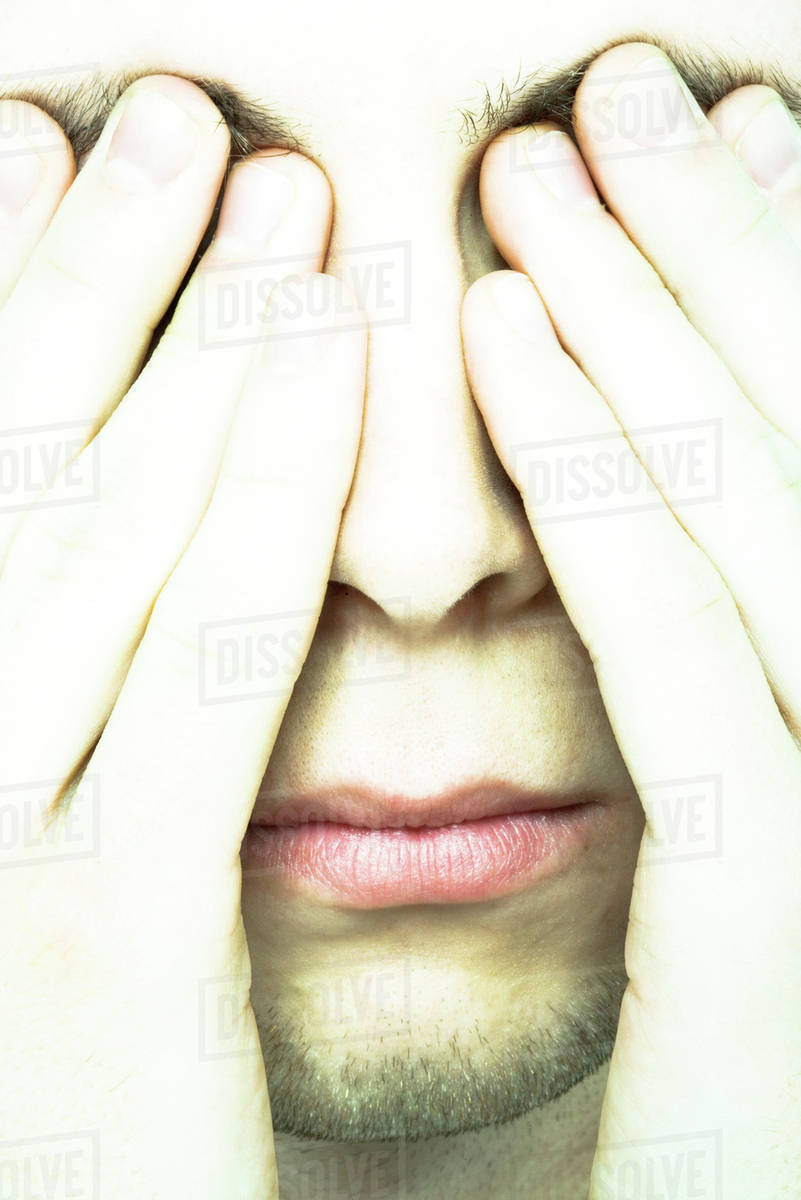Young man covering eyes, extreme close-up - Royalty-free Stock Photo ...