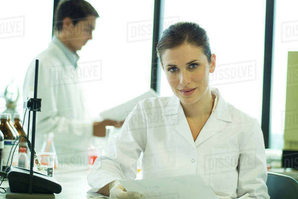 Young female scientist working in lab, portrait - Stock Photo - Dissolve