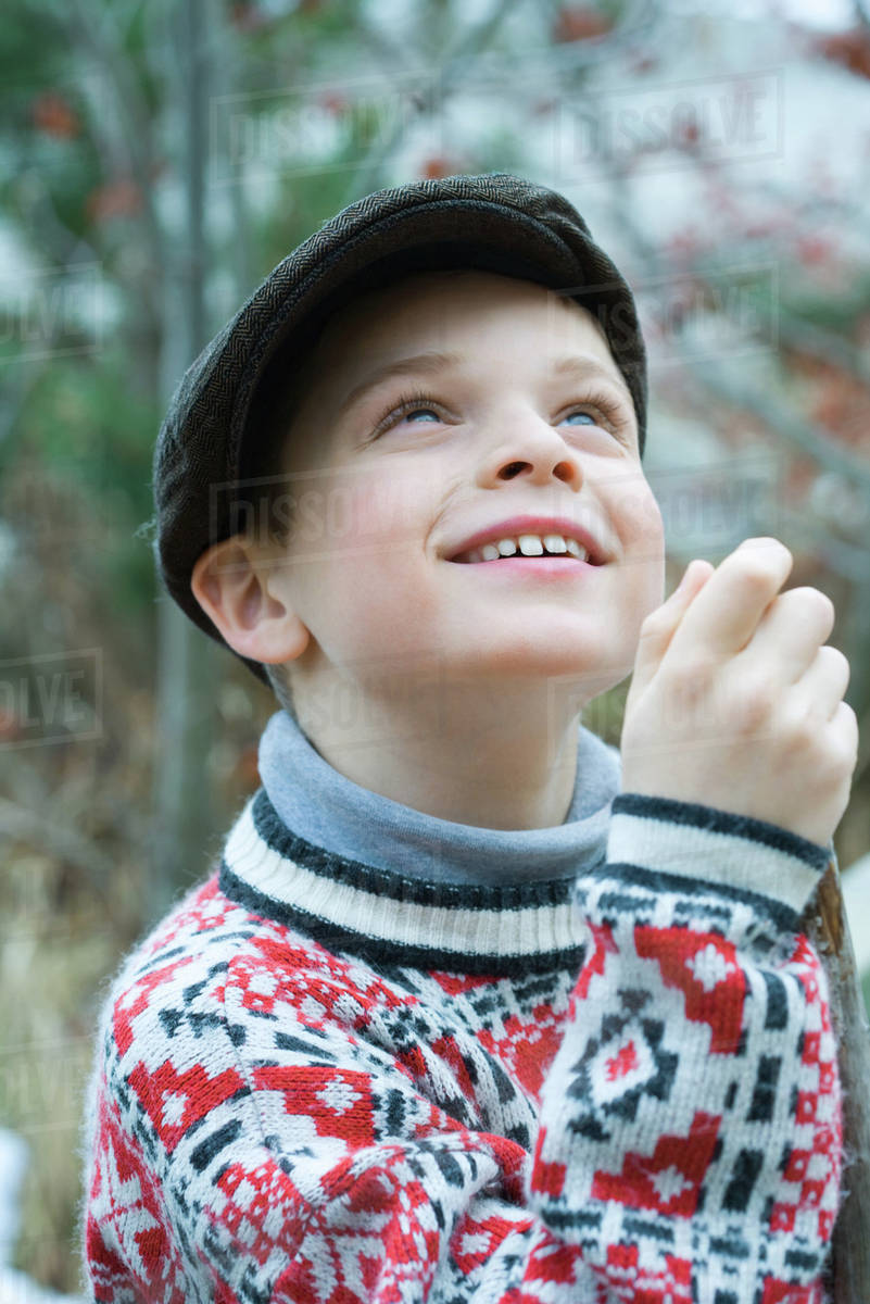 Boy looking up, portrait - Royalty-free Stock Photo | Dissolve