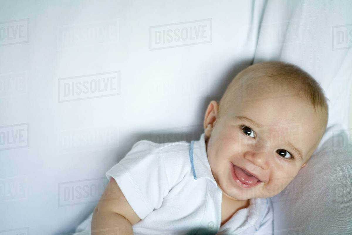 Baby smiling at camera, portrait - Royalty-free Stock Photo | Dissolve