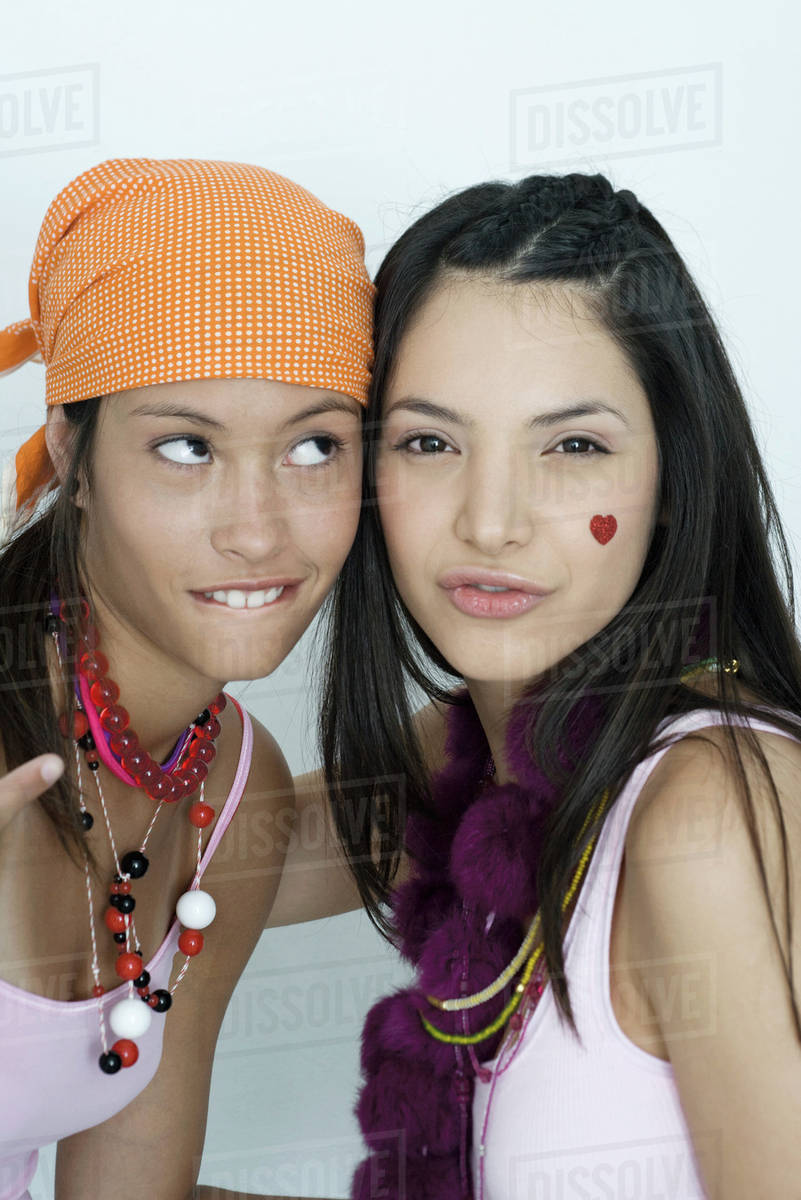 Two young female friends with cheeks together, portrait - Royalty-free ...