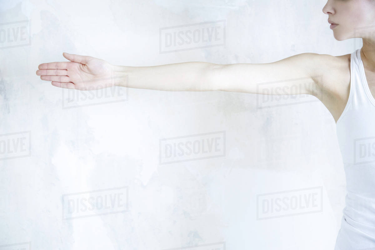 Cropped view of woman standing, arm outstretched - Royalty-free Stock ...