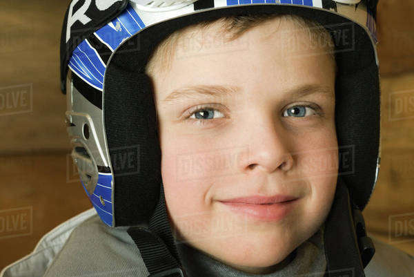 Boy wearing helmet, portrait - Royalty-free Stock Photo | Dissolve