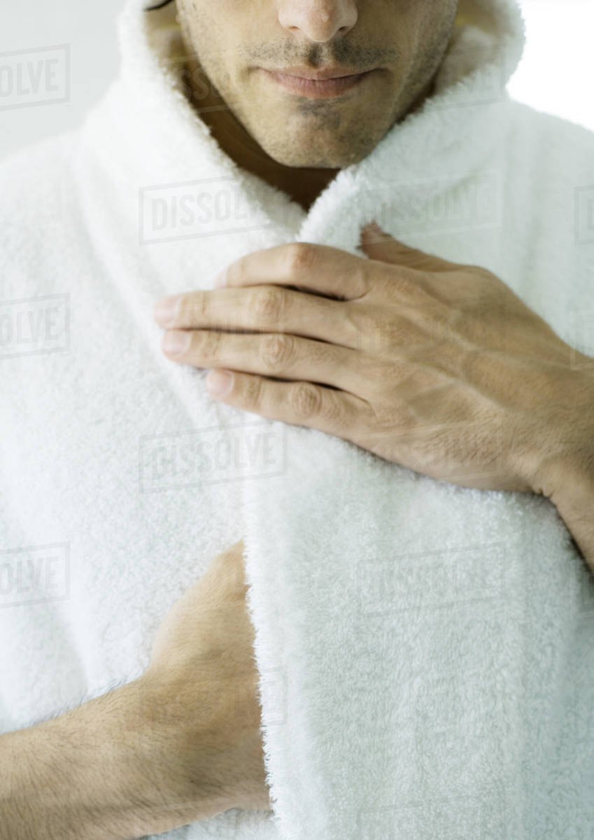 Man's hand holding bathrobe collar - Royalty-free Stock Photo | Dissolve