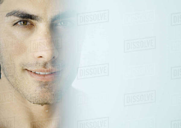 Man's face, blur in foreground - Royalty-free Stock Photo | Dissolve