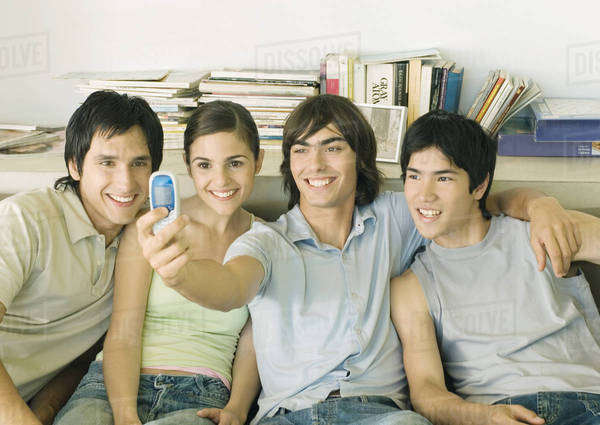 Taking group photo with cell phone - Royalty-free Stock Photo | Dissolve