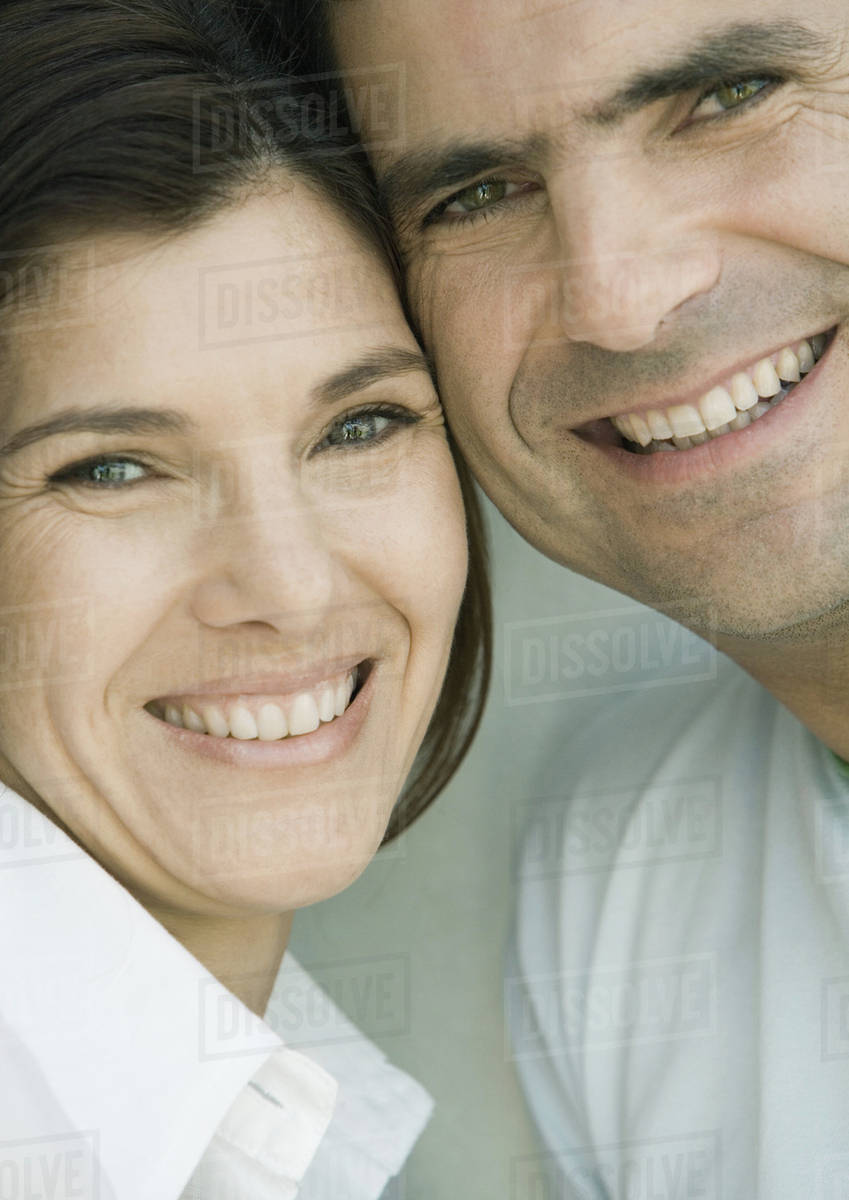 Couple cheek to cheek, smiling, front view, close-up - Royalty-free ...