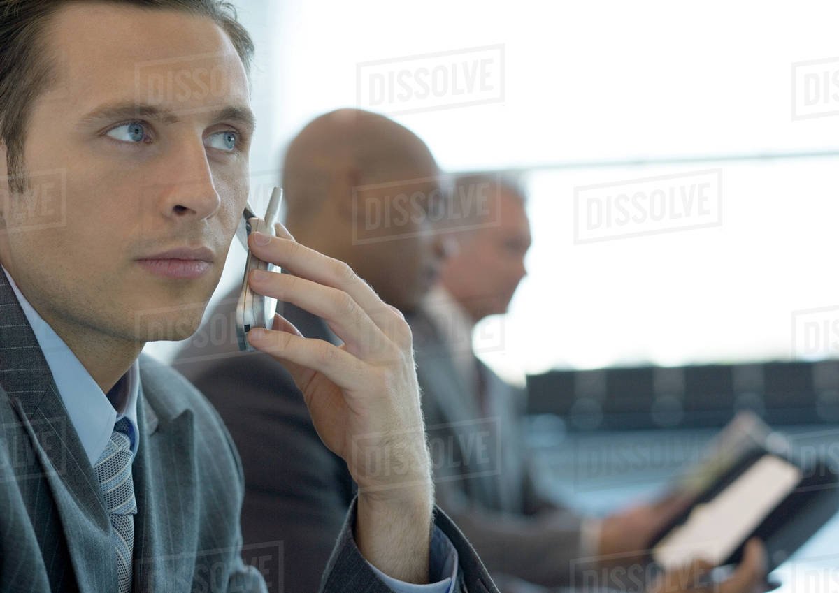 Businessman using cell phone - Royalty-free Stock Photo | Dissolve