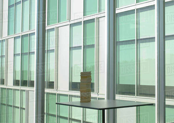 Stack of books and office building facade - Royalty-free Stock Photo ...