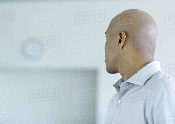 Man looking at clock - Royalty-free Stock Photo | Dissolve