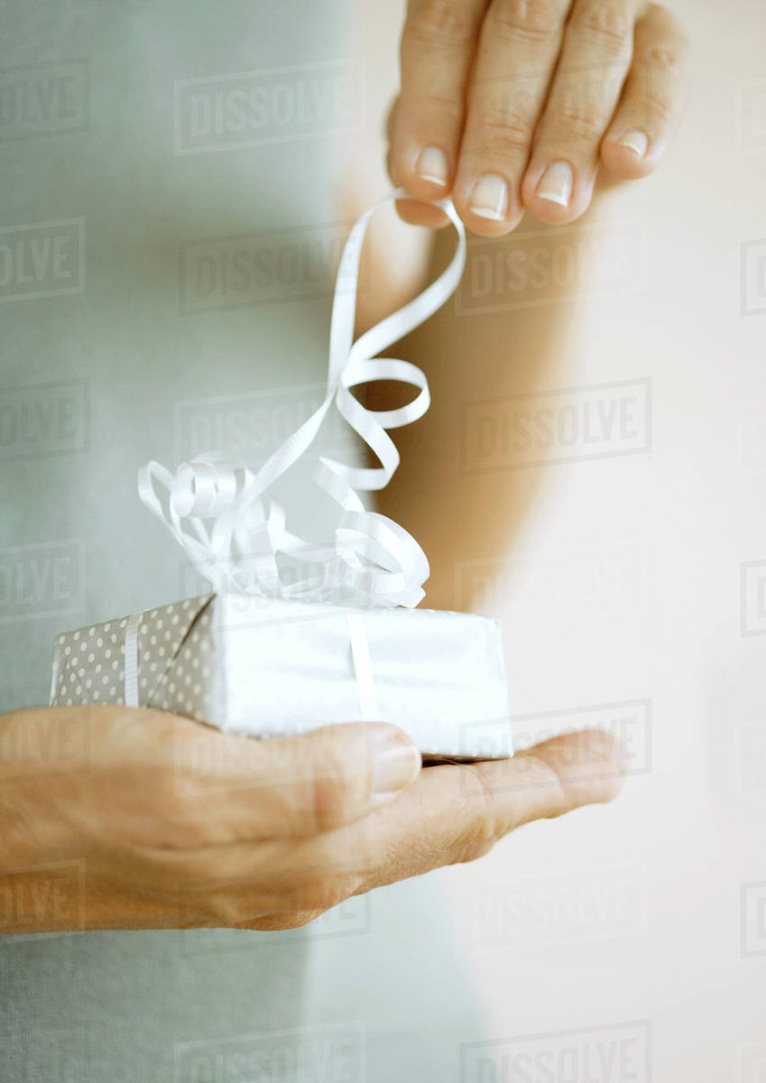 Man handing woman gift, close-up of hands - Royalty-free Stock Photo ...