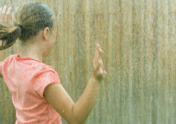 Girl getting wet - Stock Photo - Dissolve