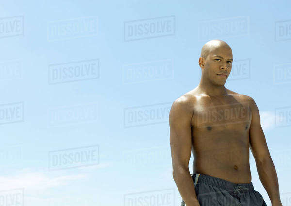 Man standing in sun - Royalty-free Stock Photo | Dissolve