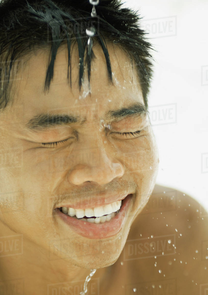 Man splashing face - Stock Photo - Dissolve