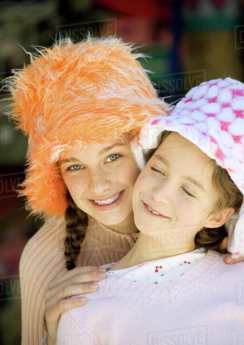 Two girls wearing funny hats, portrait - Royalty-free Stock Photo ...