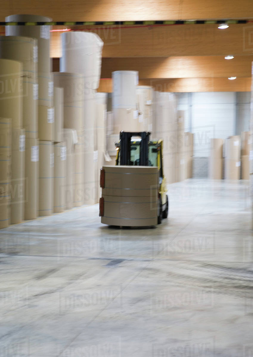 Forklift transporting roll of paper in warehouse - Royalty-free Stock ...