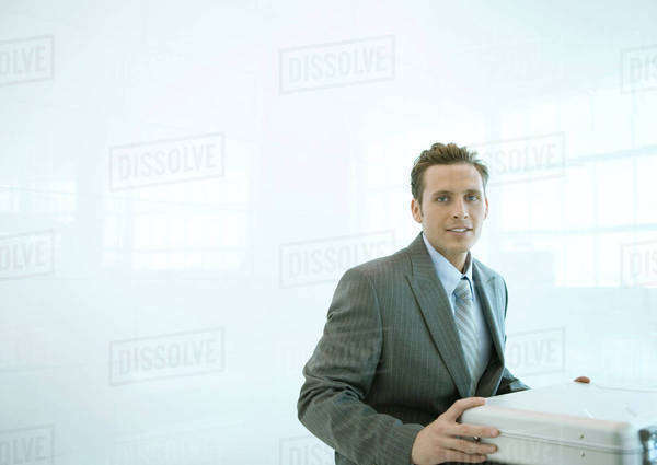 Businessman opening briefcase - Royalty-free Stock Photo | Dissolve