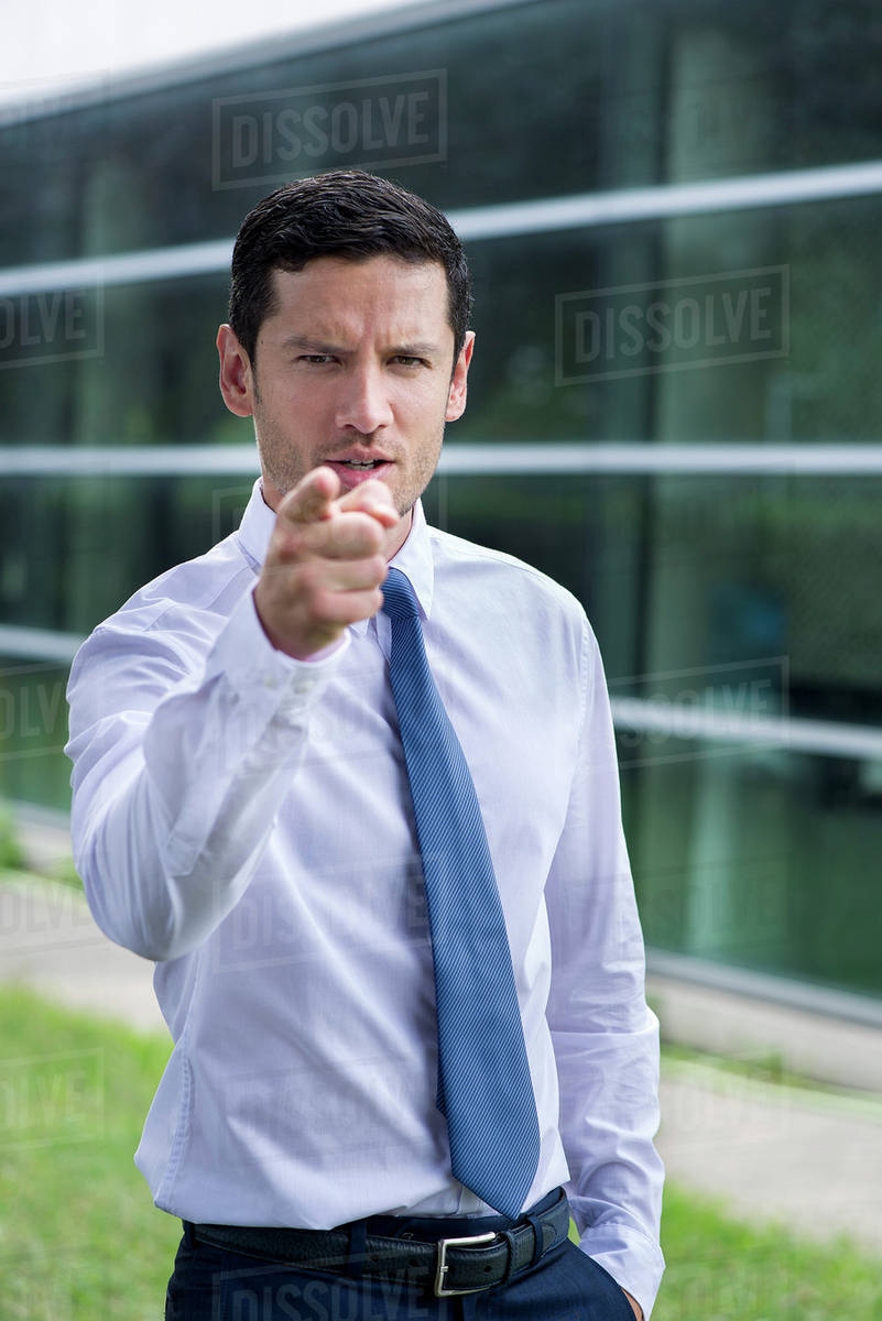 Businessman pointing finger in accusation - Stock Photo - Dissolve