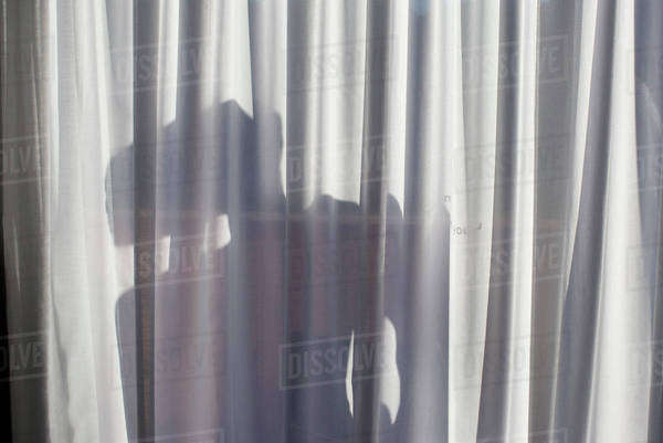 Shadow of a person on window curtain - Royalty-free Stock Photo | Dissolve