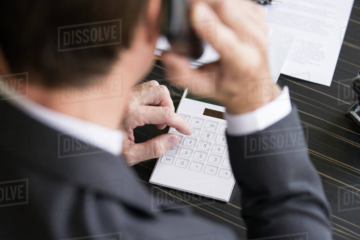 Accountant reviewing financial accounts - Royalty-free Stock Photo ...