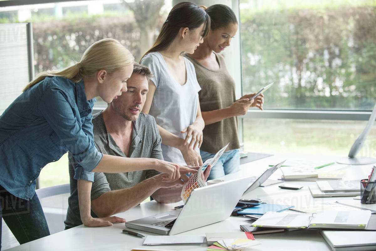 Project team working closely together - Royalty-free Stock Photo | Dissolve