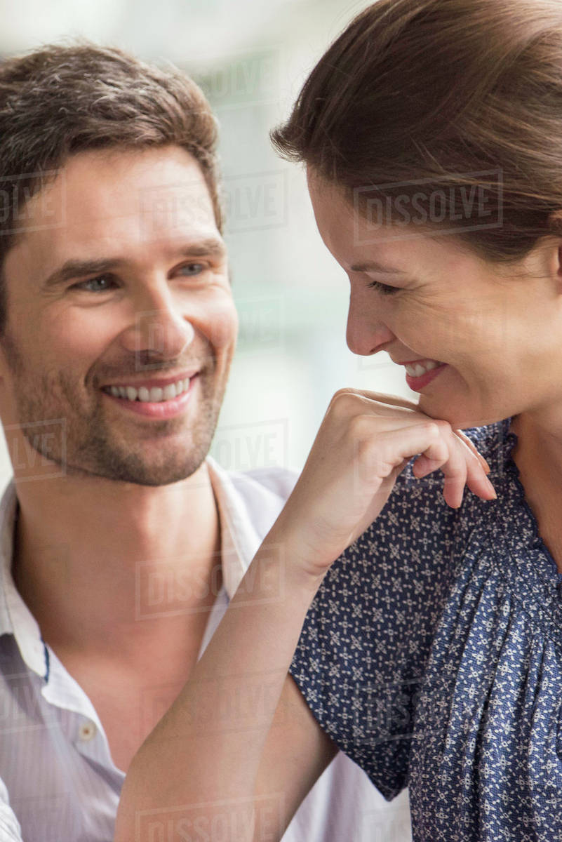Couple smiling together at home - Stock Photo - Dissolve